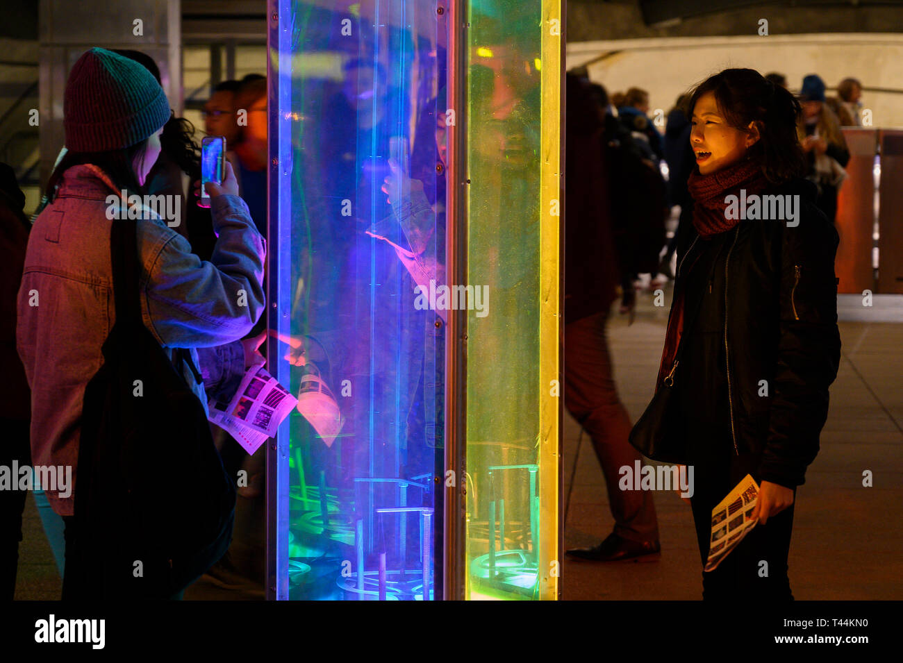 A happy person looking at the Prismatica art installation at Canary ...