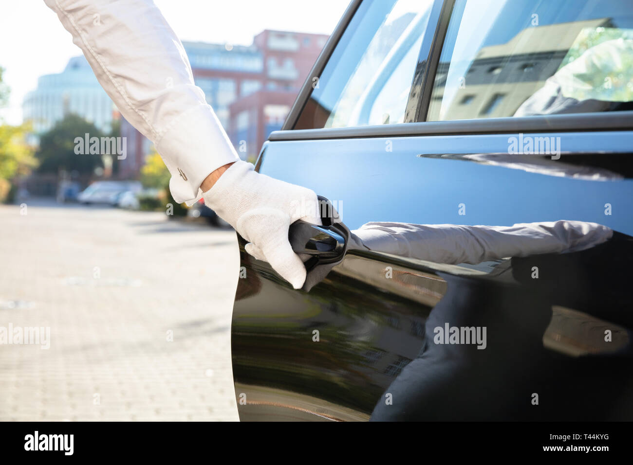 Opening doorman car door hi-res stock photography and images - Alamy
