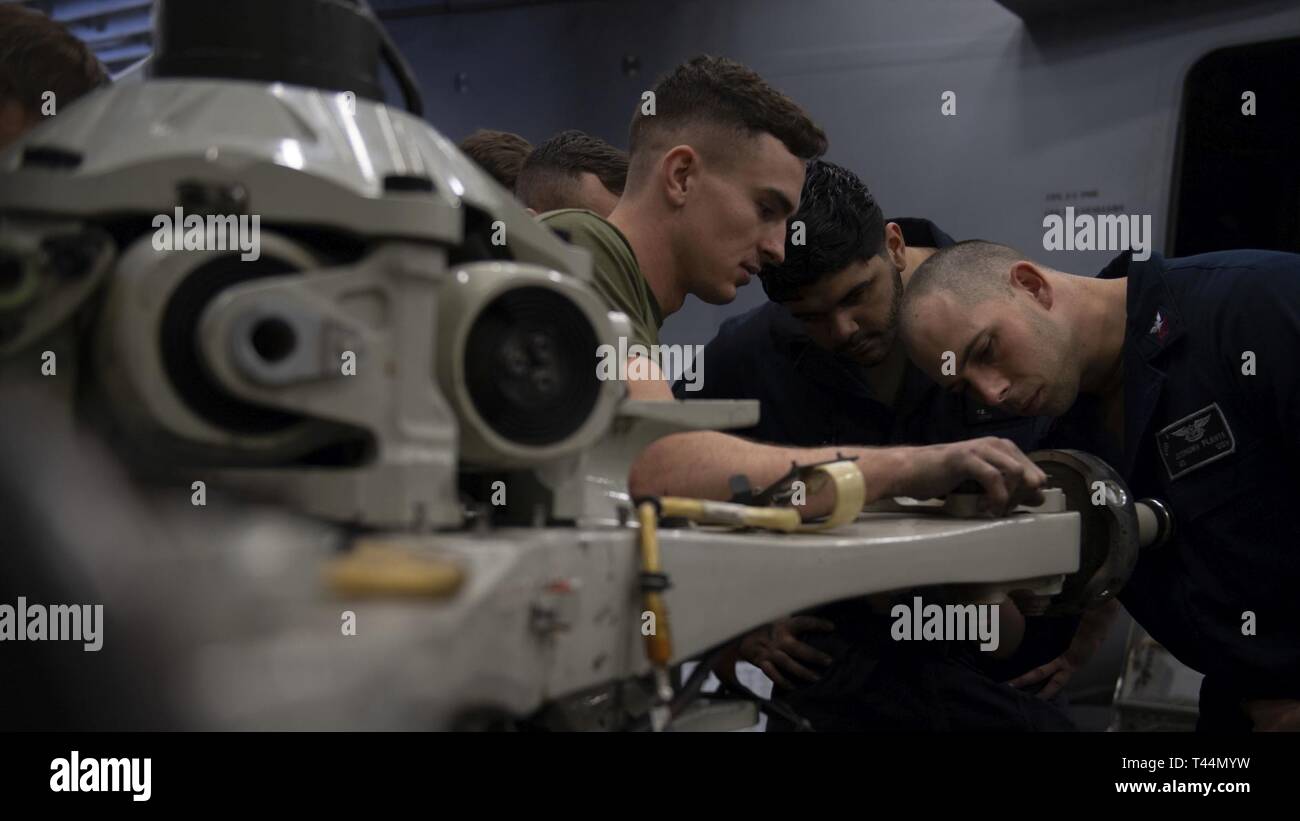 OCEAN (Feb. 20, 2019) U.S. Marines and Sailors inspect a prop rotor hub ...