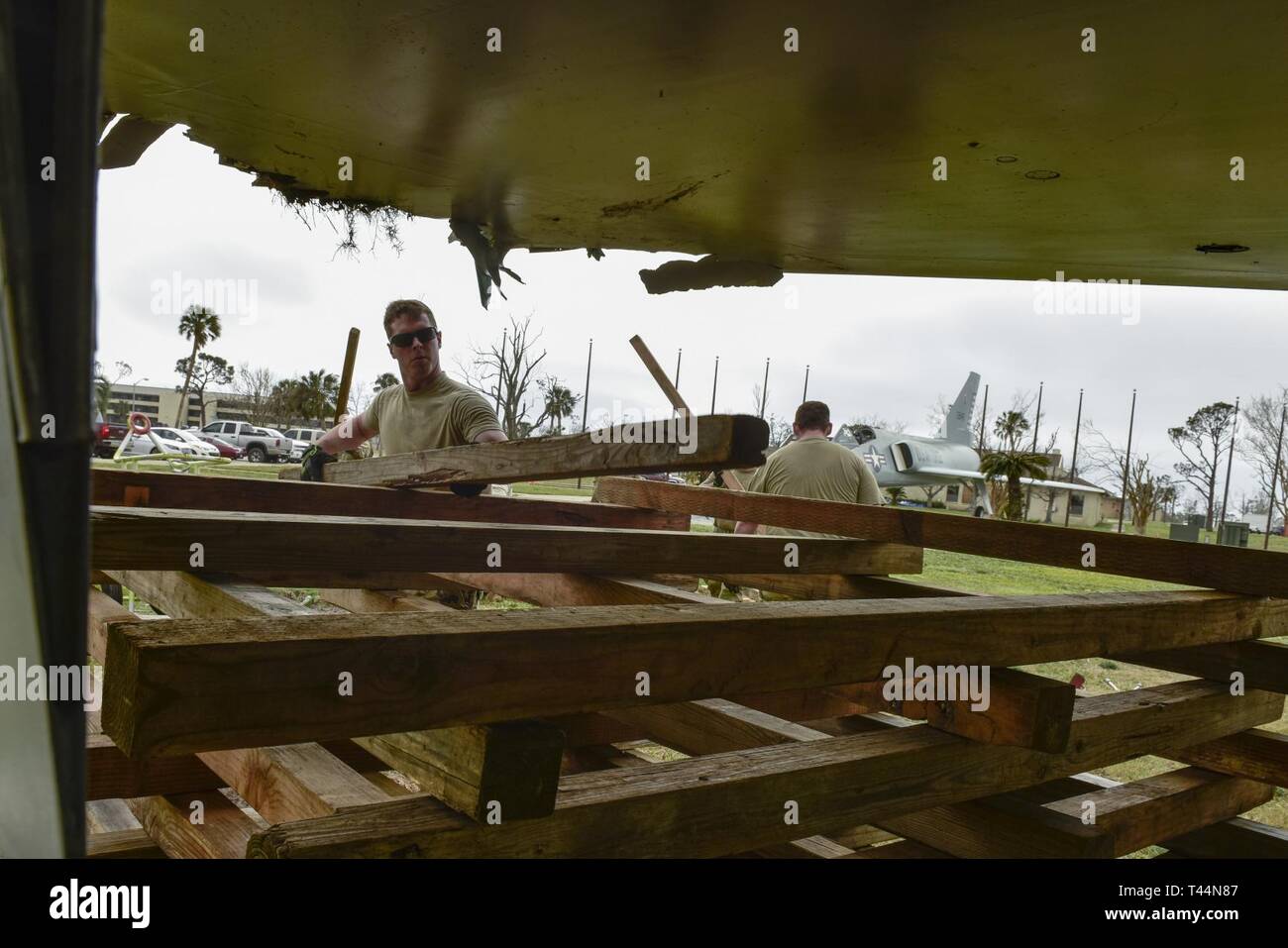 Airmen form the 325th Maintenance Squadron prepare to disassemble and ...