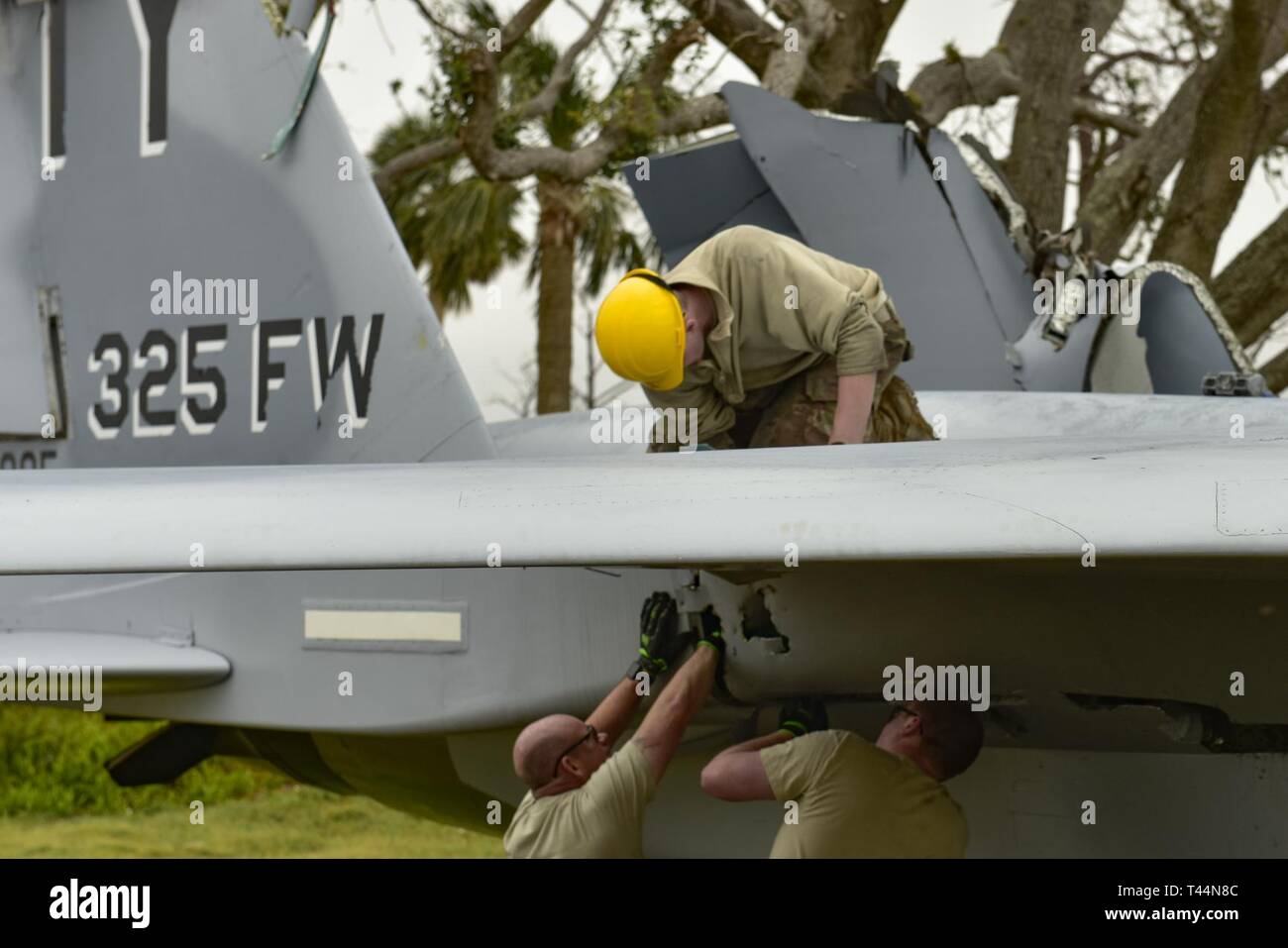 Airmen form the 325th Maintenance Squadron prepare to disassemble and ...