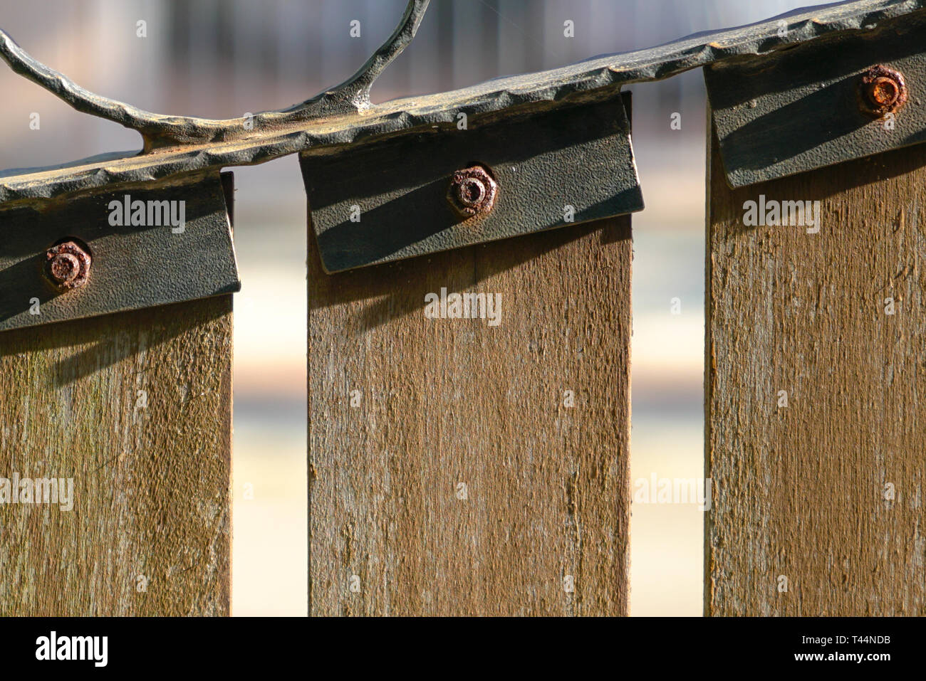 Vertical wood and metal planks of an auto gate Stock Photo - Alamy