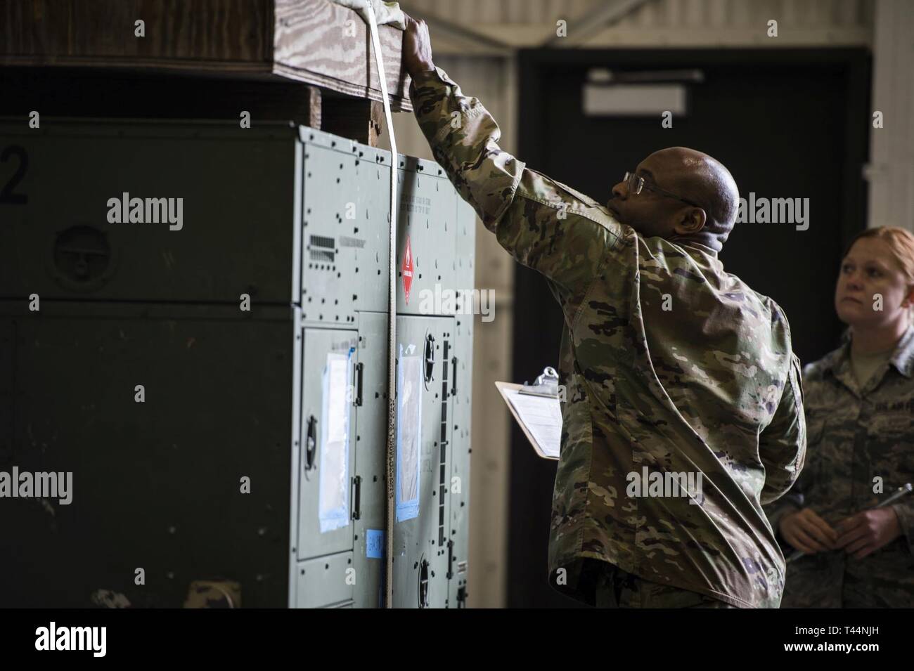 U.S. Air Force Staff Sgt. Robert Myers, an aerial porter assigned to ...
