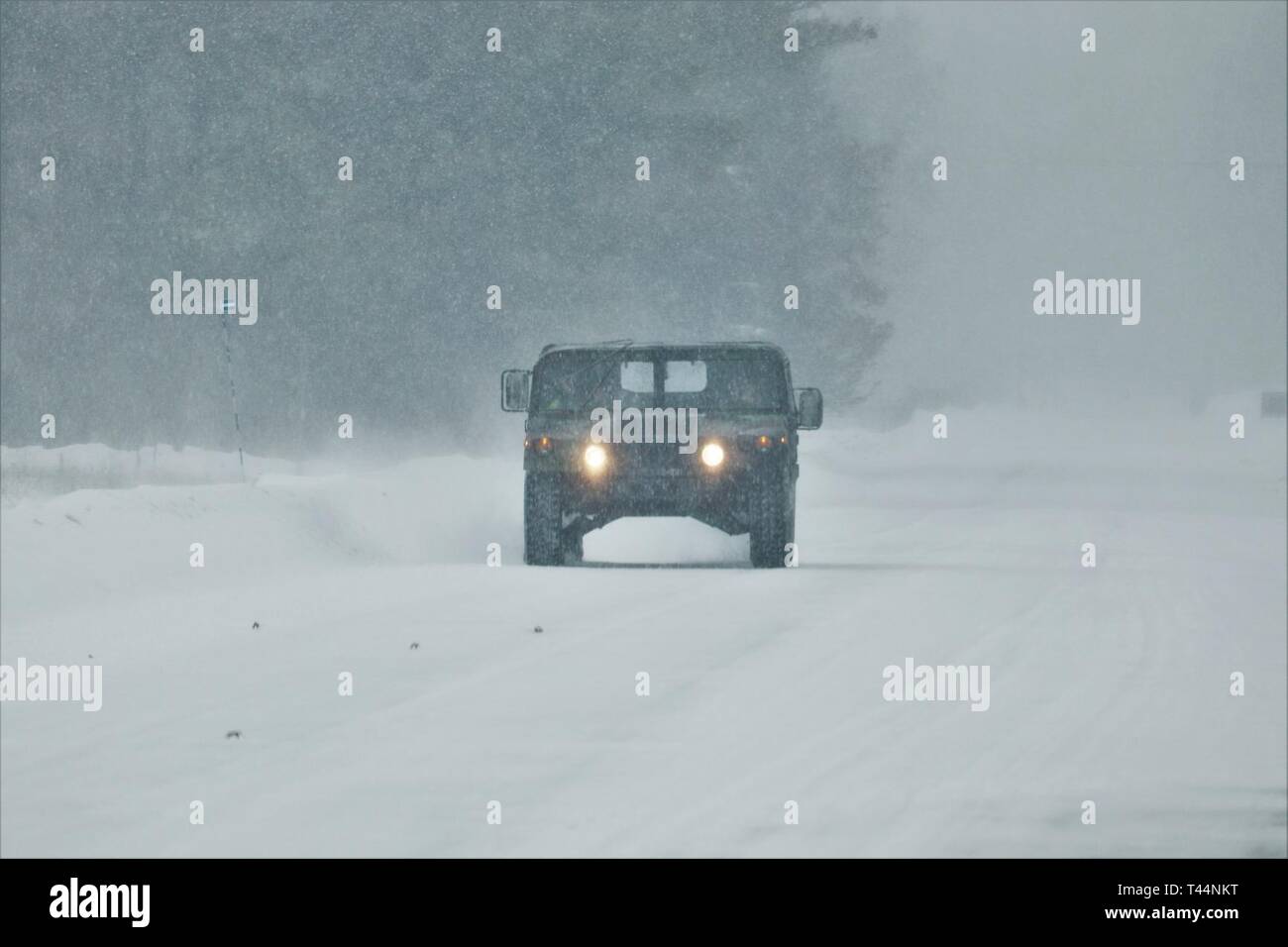 Soldiers at Fort McCoy, Wis., for training drive a Humvee on the ...