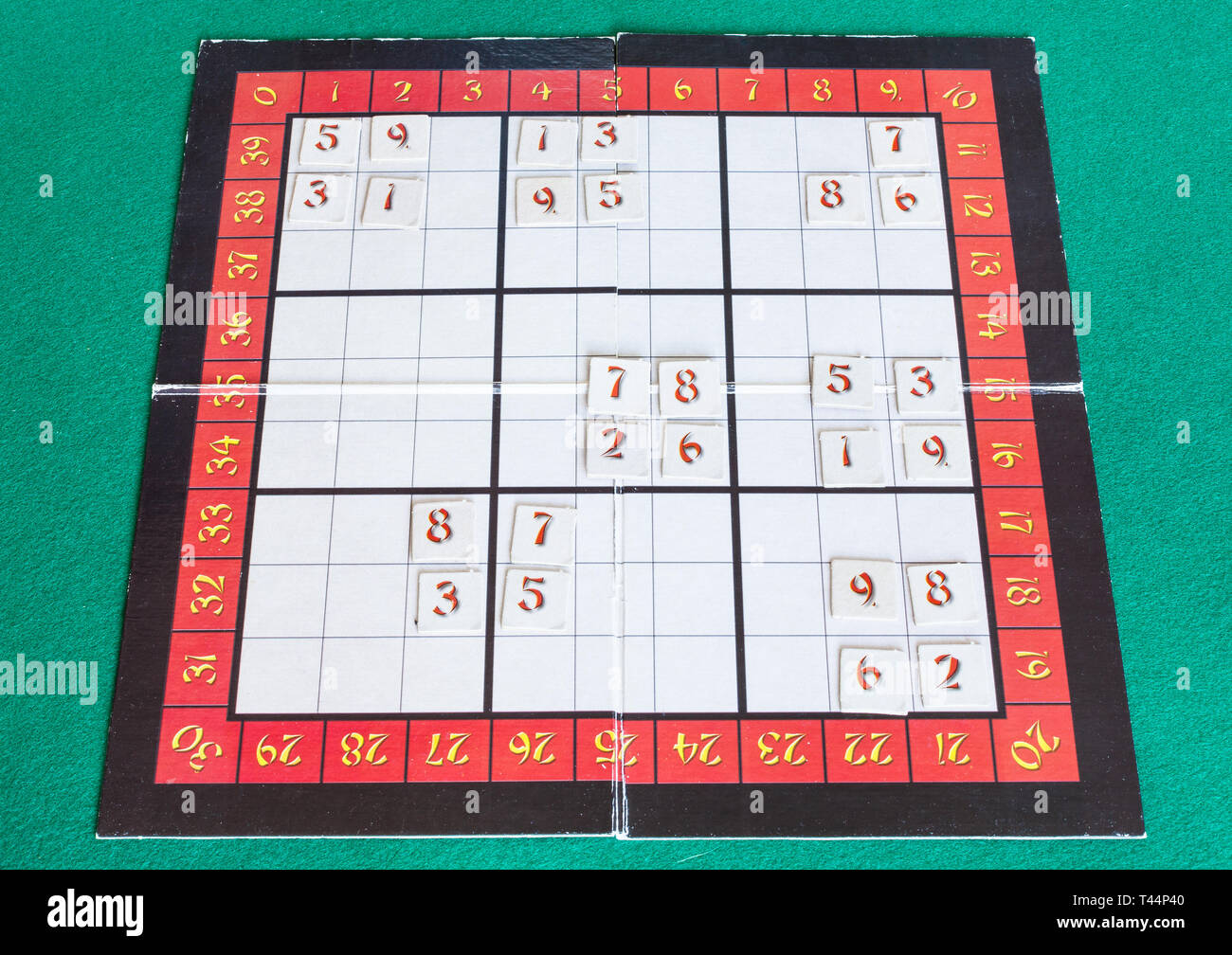 MOSCOW, RUSSIA - APRIL 2, 2019: paper playfield of Sudoku board game on green baize table ...