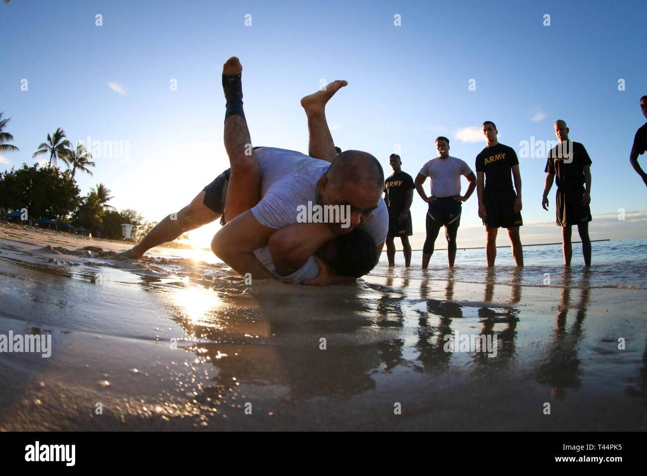 U.S. Air Force Maj. Fredrick Cruz, holds down a fellow Airman during a ...