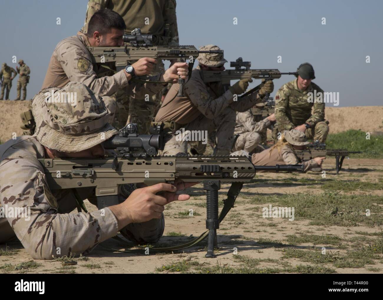 Spanish soldiers assigned to the Training Team Brigade fire British ...