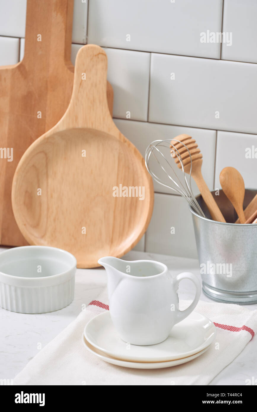 Simple rustic kitchenware against white wooden wall: rough ceramic pot ...