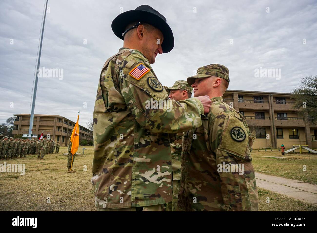 Lt. Col. Alex Lee awards the combat medical badge to Spc. Cory Burbage ...
