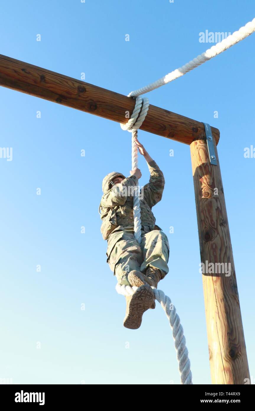 Spc. Fernando Segura, a biomedical equipment specialist, scales the ...