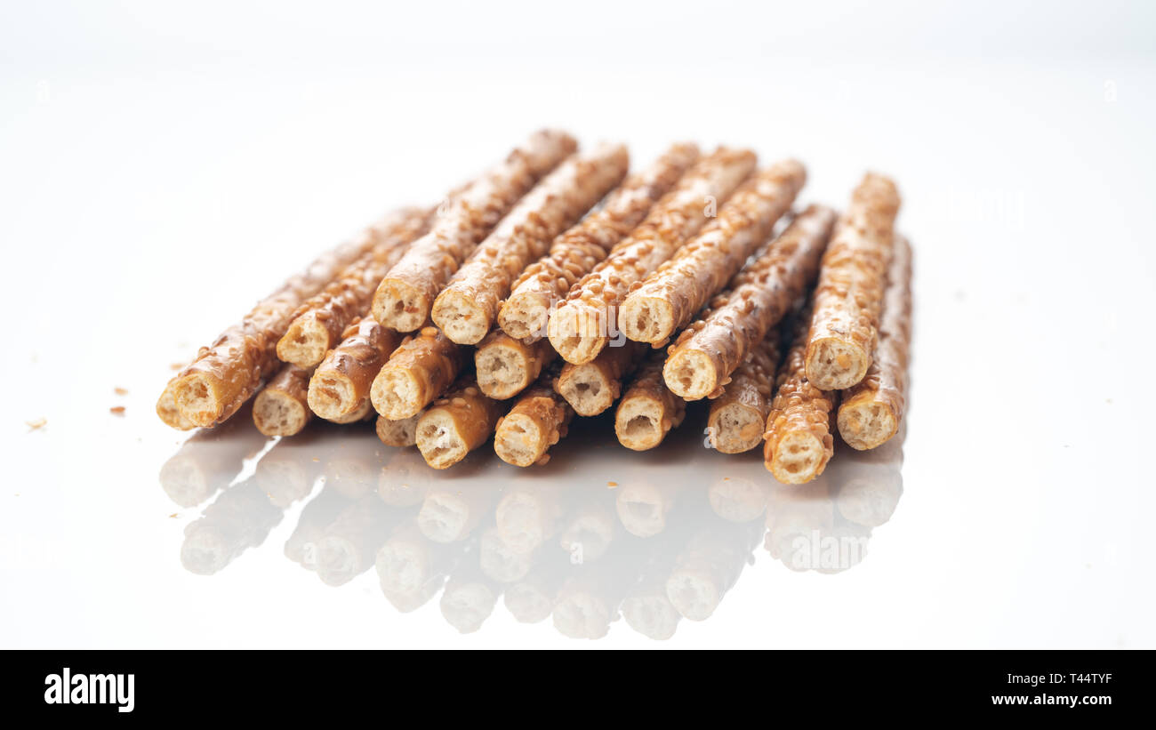 Sesame sticks on a white background Stock Photo - Alamy