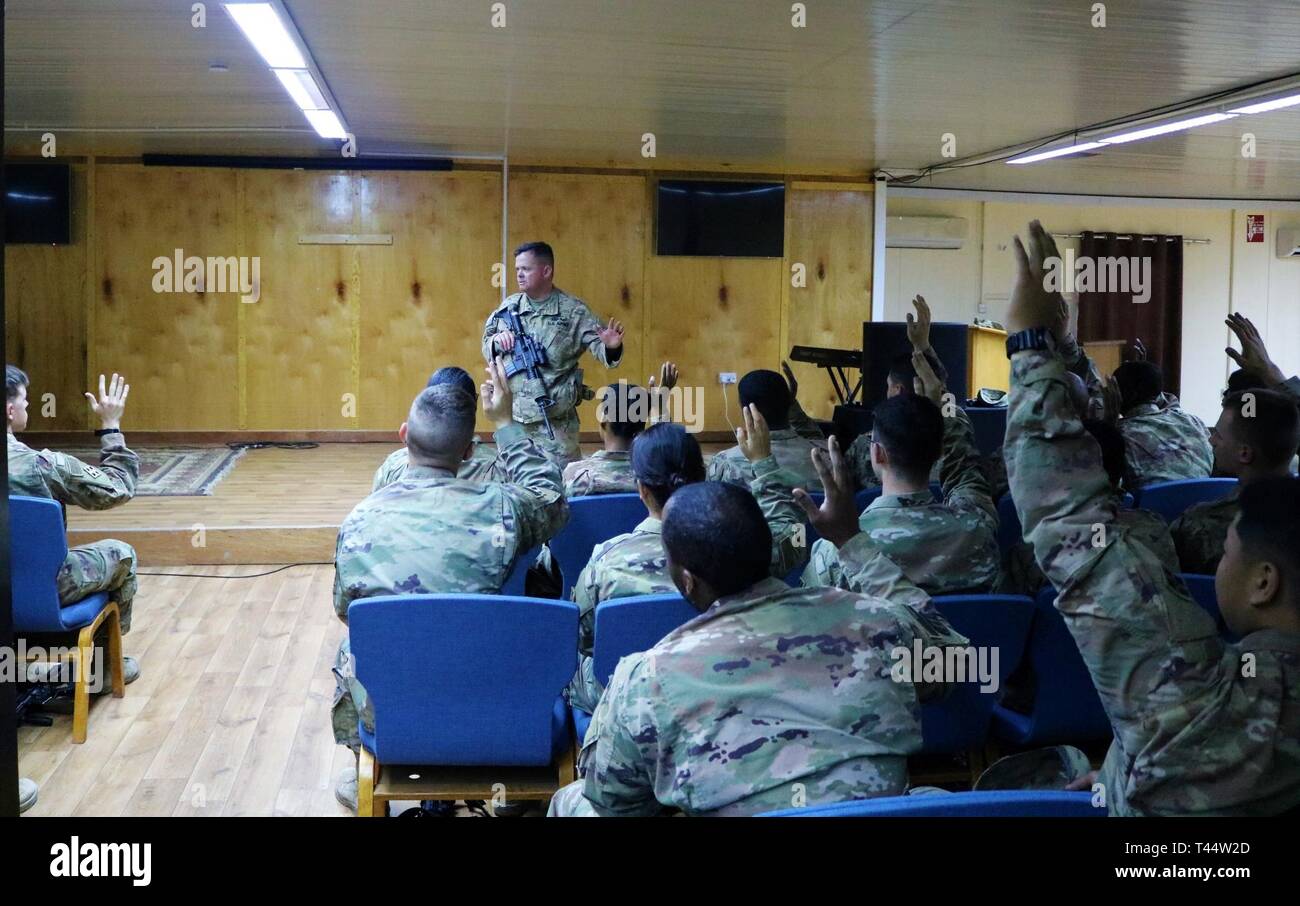 Command Sgt. Maj. Roderick Upton, 300th Sustainment Brigade, receives a ...
