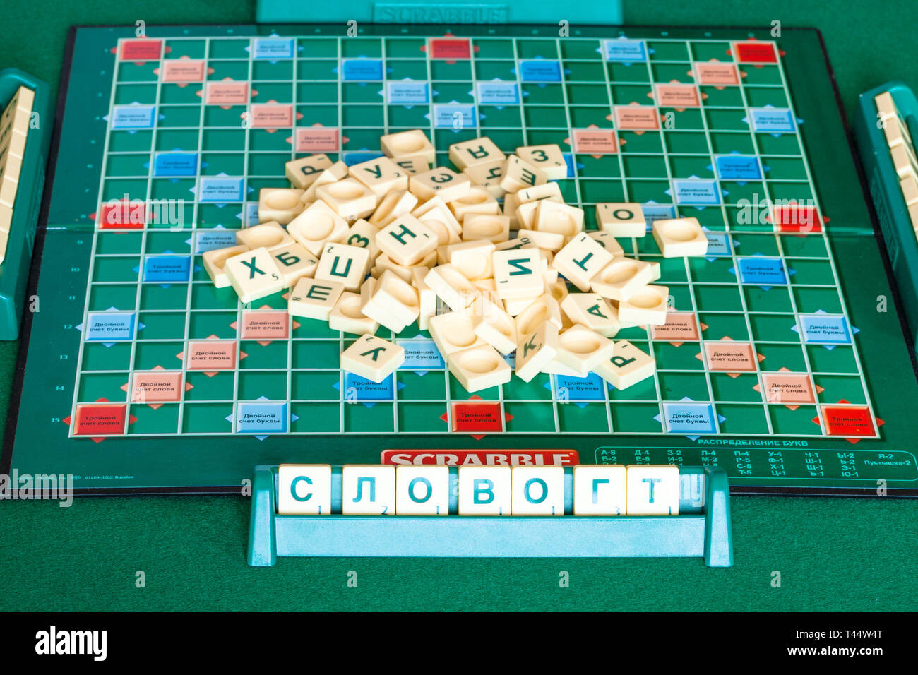 MOSCOW, RUSSIA - APRIL 3, 2019: pile of letter tiles on board of ...