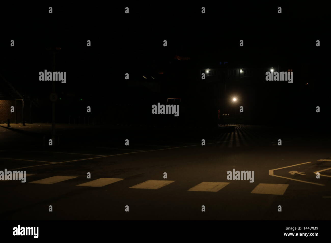 Empty crosswalk on a British street at night. Britain, UK Stock Photo ...