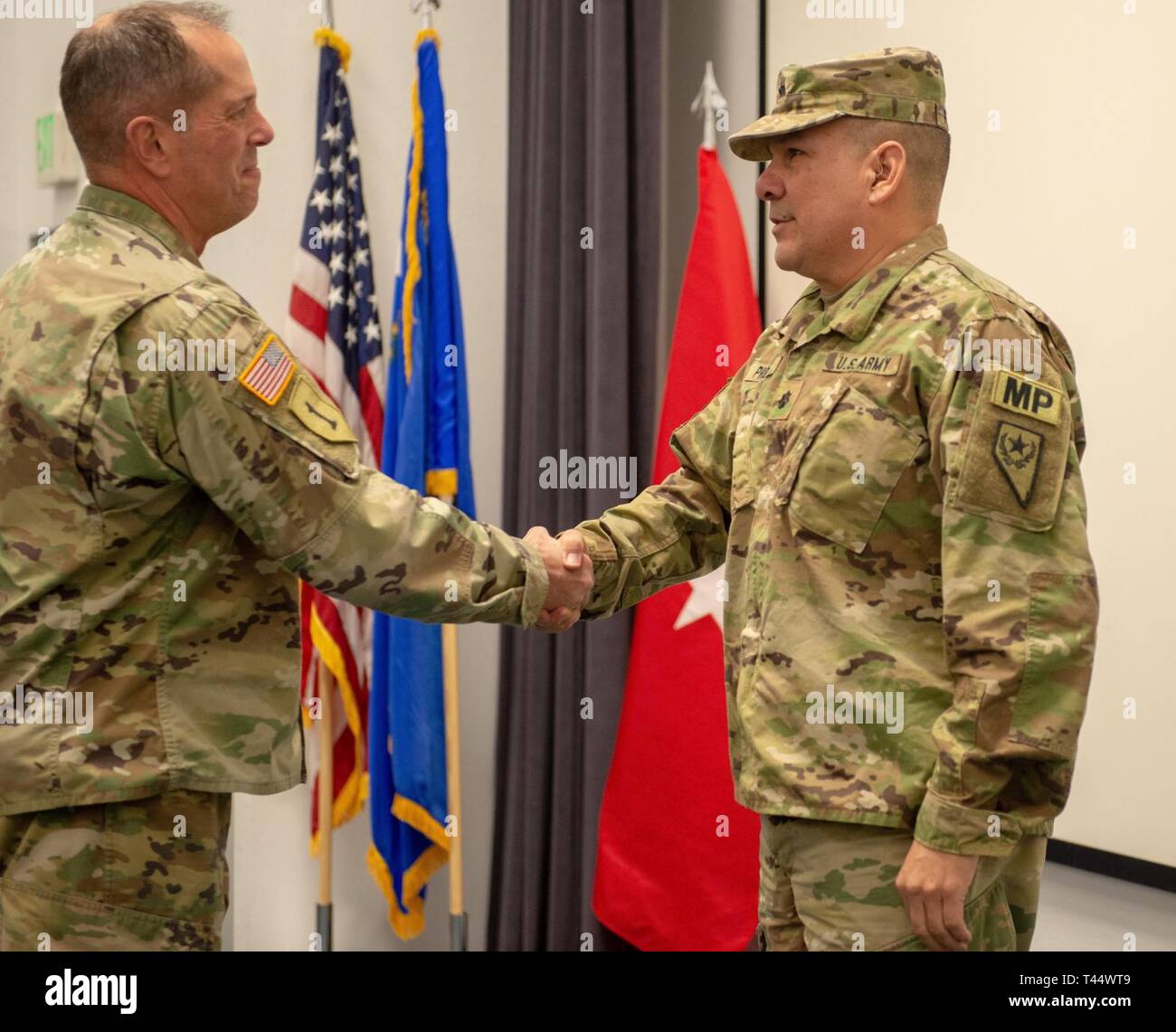Lt. Col. James Phoenix, right, shakes hands with Brig. Gen. Zachary ...