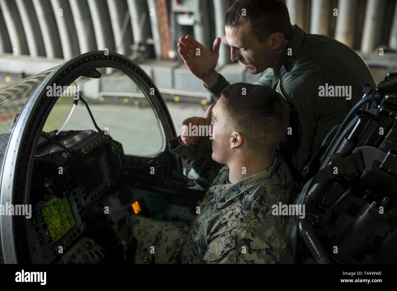 A Royal Air Force Eurofighter Typhoon pilot teaches a U.S. Marine with ...