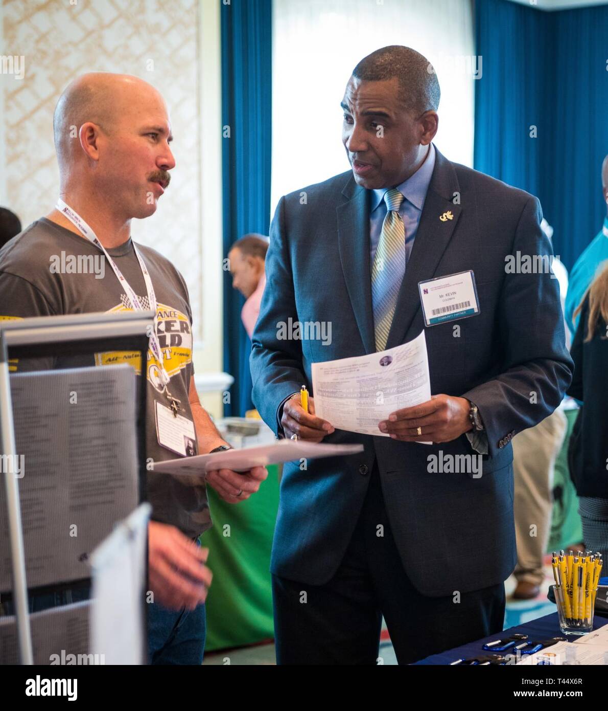 Kevin Coleman, a representative from Drexel University, speaks with a ...