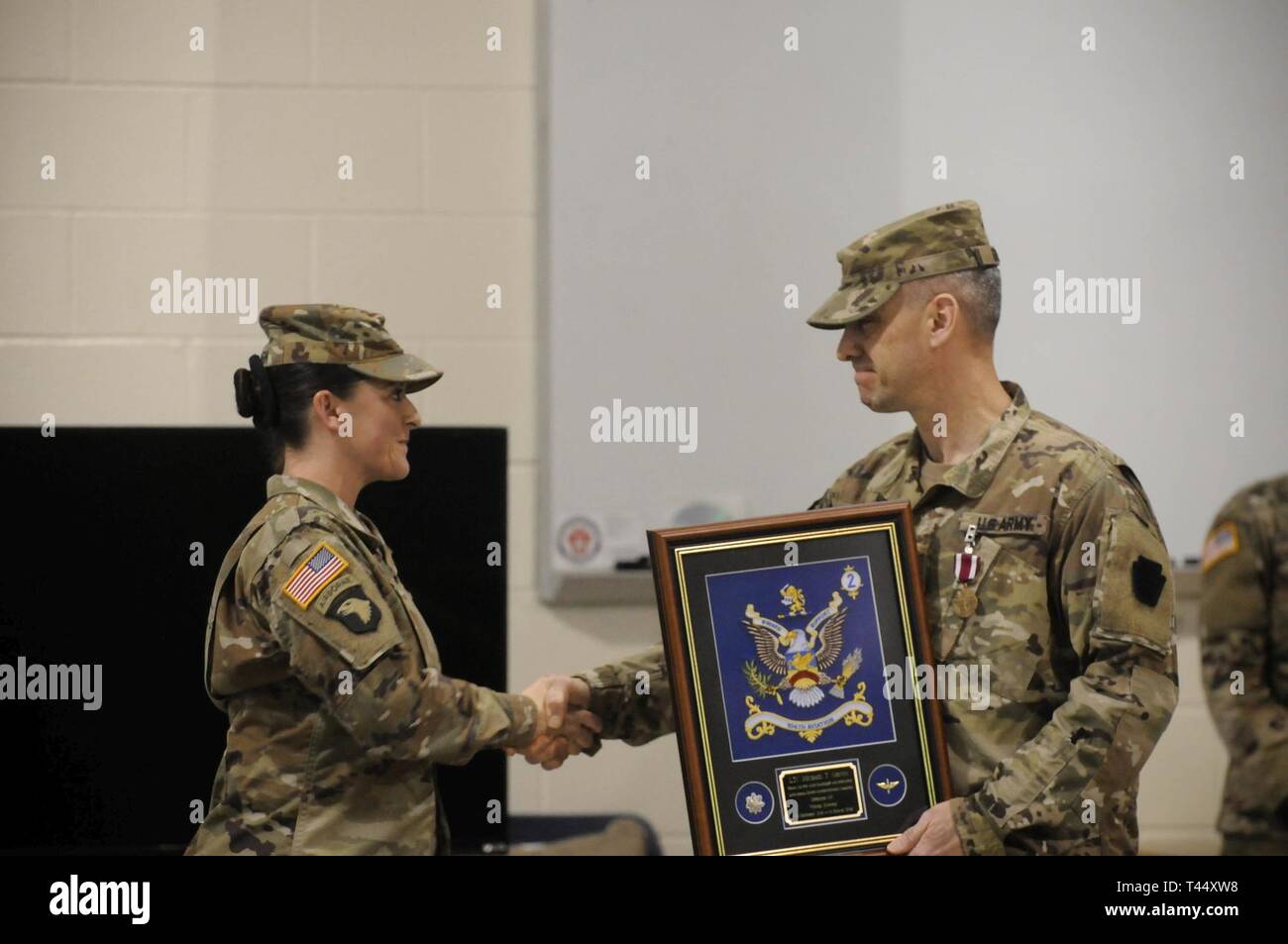 U.S. Army Lt. Col. Michael Girvin, right, outgoing commander of the 2 ...