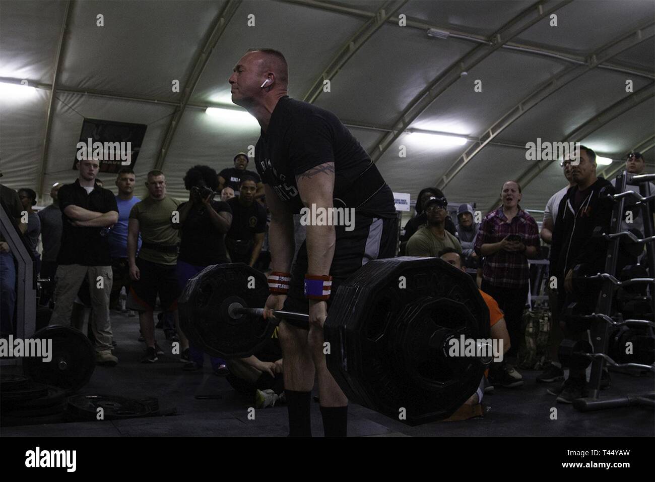 Sgt. 1st Class Steven Zellner with the 300th Sustainment Brigade lifts ...