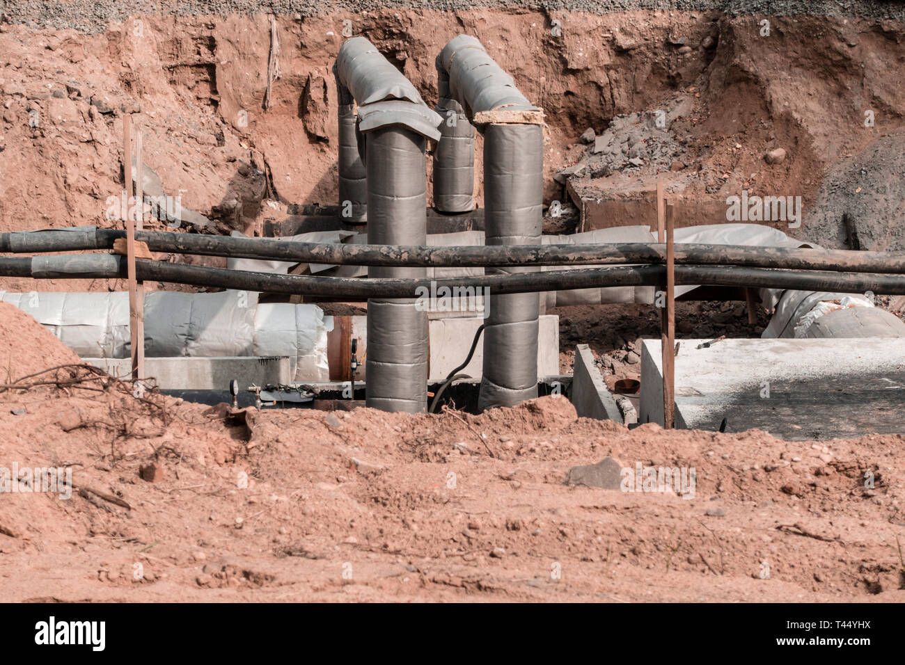 in the ground large pit was excavated. repair of water pipes Stock ...