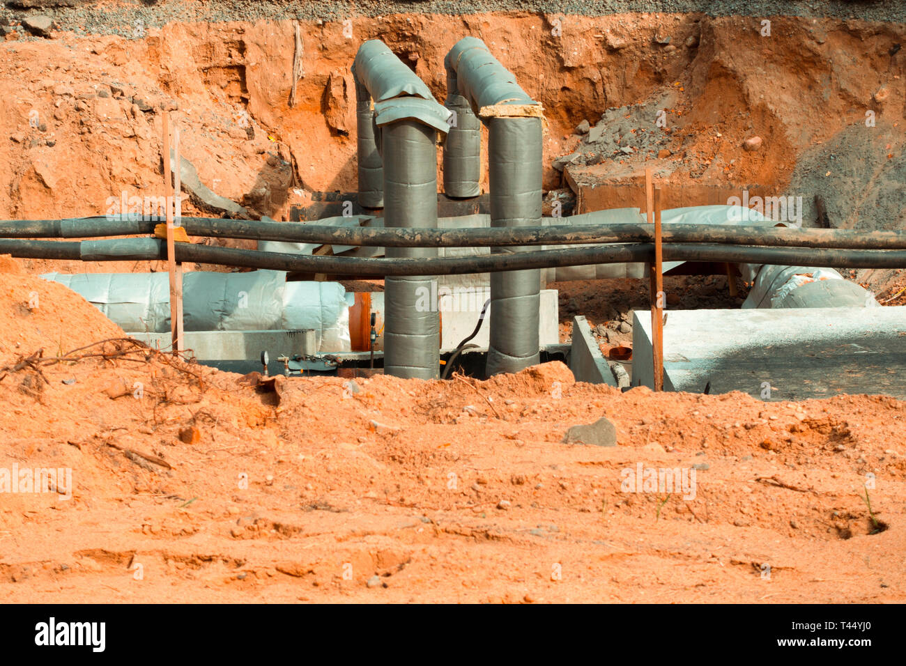 in the ground large pit was excavated. construction of water pipes ...