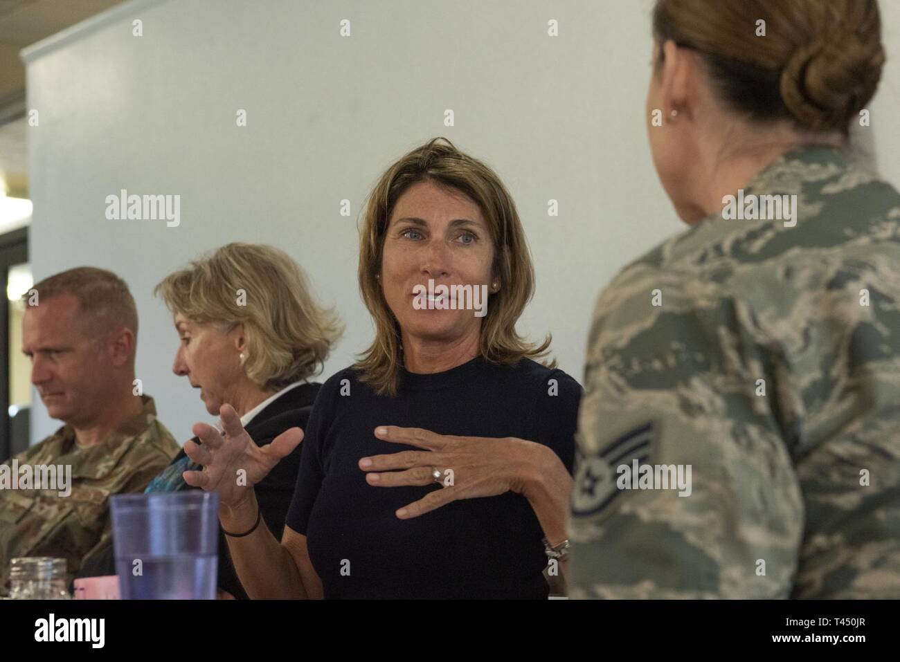 Sarah Troff, converses with Airmen about their experience during and ...