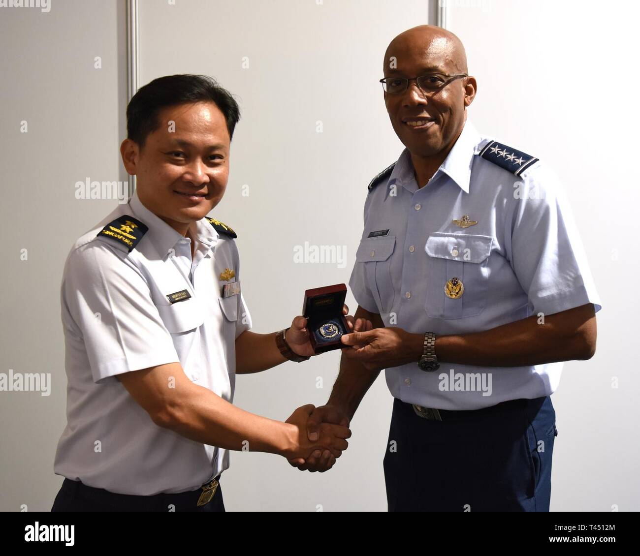 U.S. Air Force Gen. CQ Brown, Jr., Pacific Air Forces commander, right ...