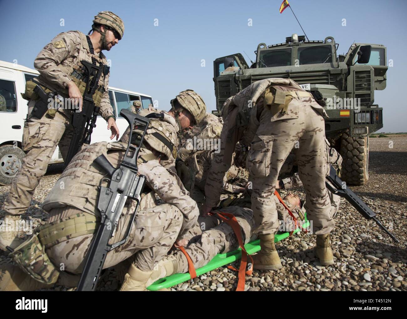 Treating wounded soldier under fire hi-res stock photography and images ...