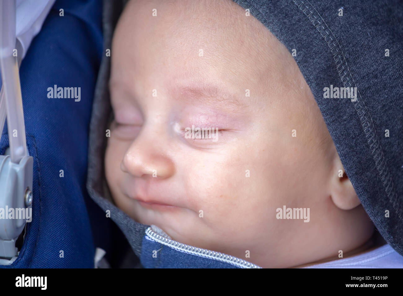 Newborn baby head sleeping in a baby carriage Stock Photo - Alamy