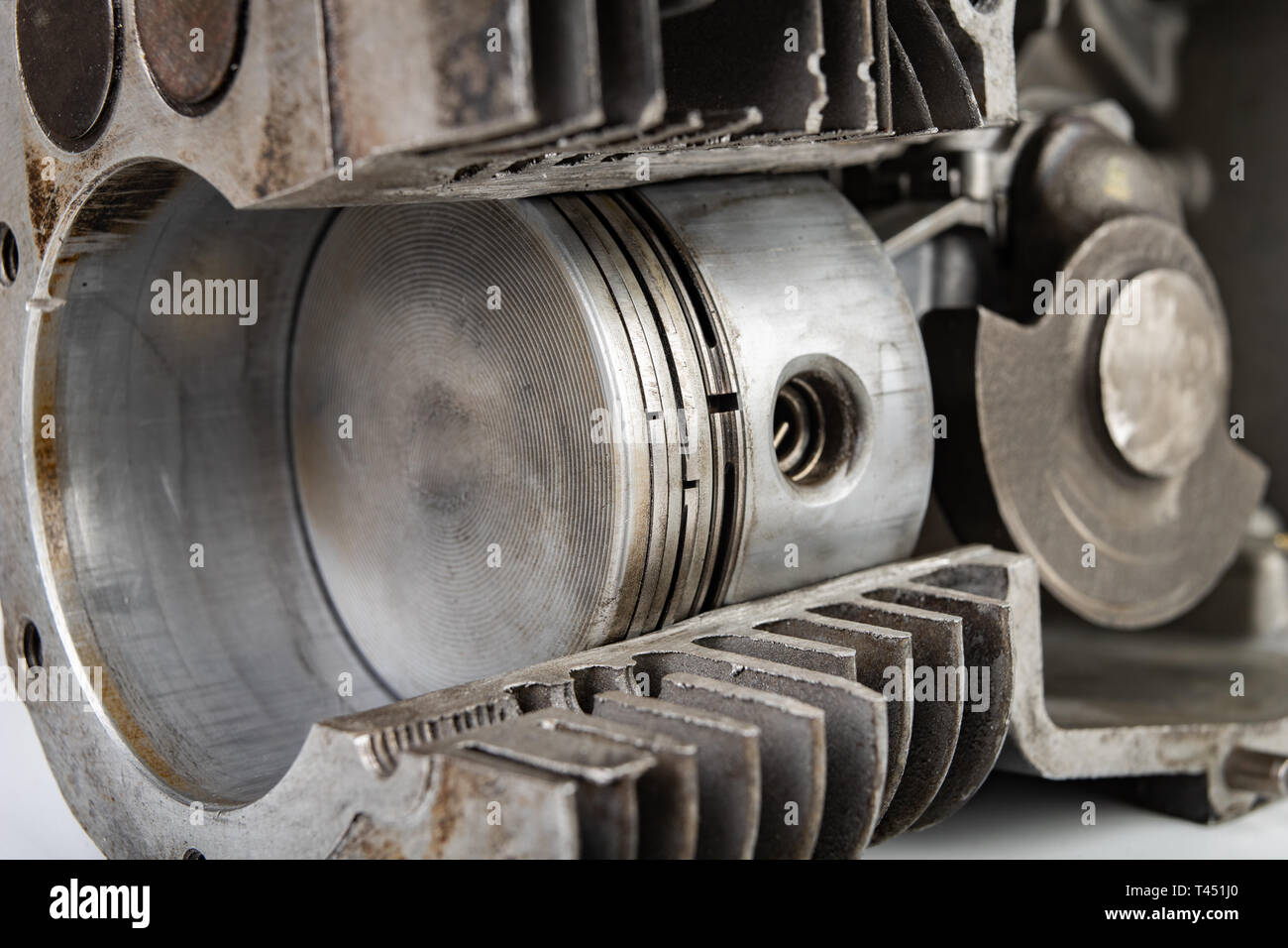 A four-stroke gasoline engine in section. The interior of a single ...