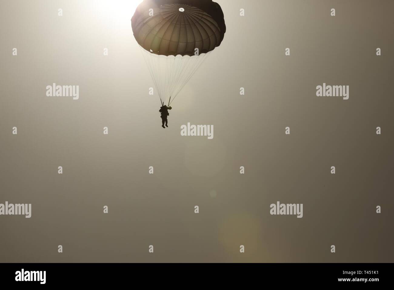 U.S. Army soldier scans the drop zone in order to conduct a parachute ...