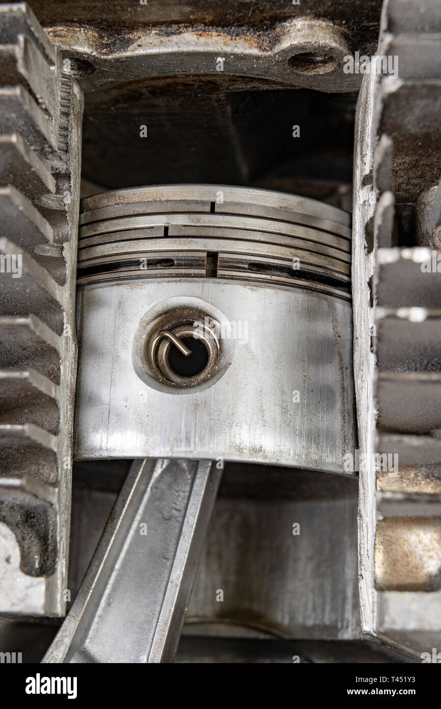 A four-stroke gasoline engine in section. The interior of a single ...