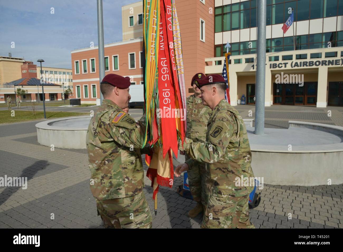 Command Sgt. Maj. James A. LaFratta, right, passes the colors to Lt ...