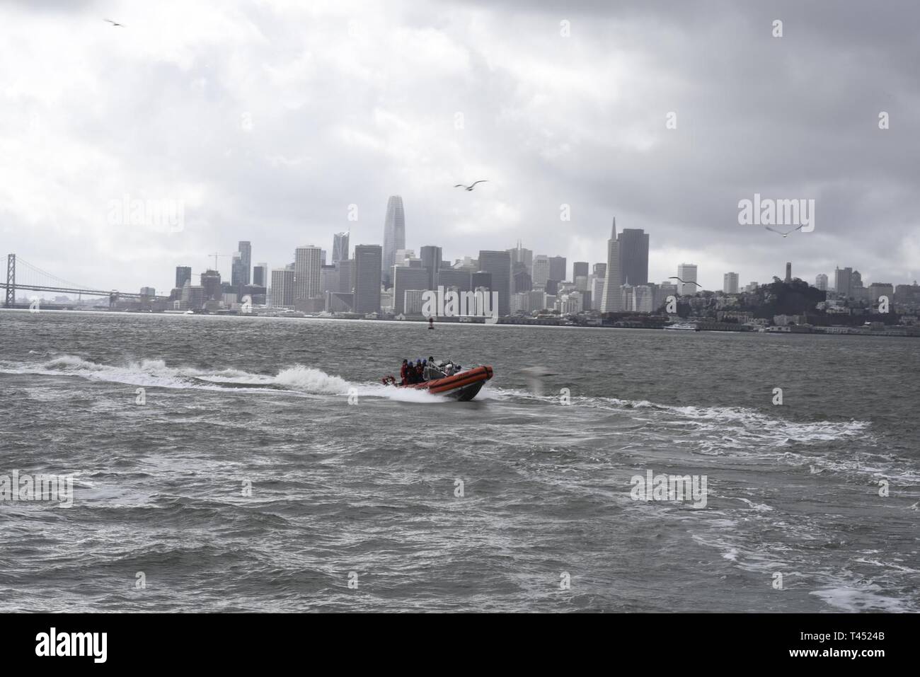Crewmembers stationed aboard the Coast Guard Cutter Robert Ward, a ...