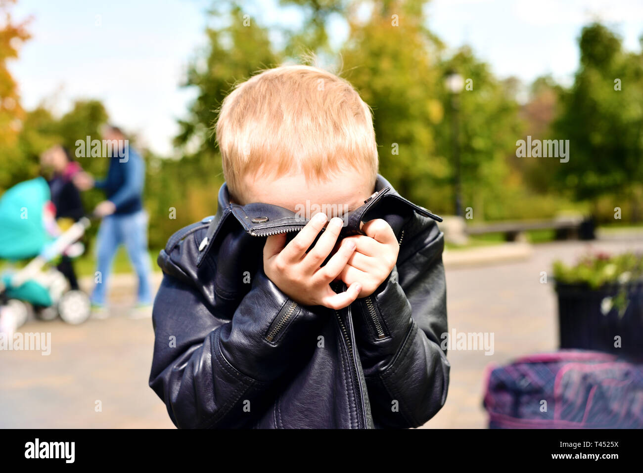little boy playing hide and seek hid Stock Photo - Alamy