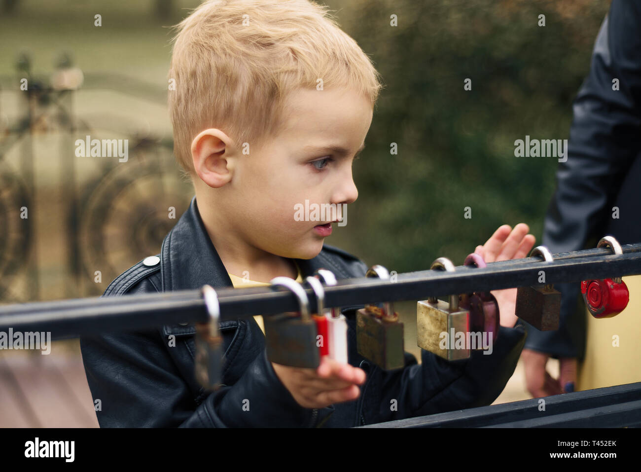 portrait of cute little boy. the child plays and looks at the door ...