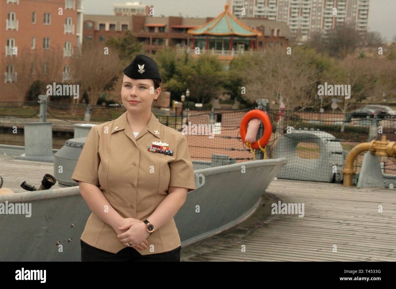 GM2(SW) Danielle D. Desiqueria, assigned to the Harpers Ferry Class ...