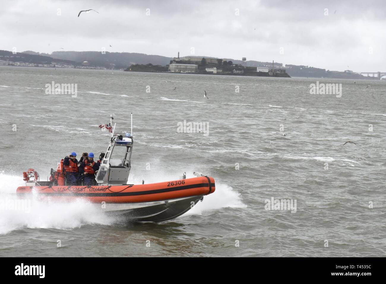 Crewmembers stationed aboard the Coast Guard Cutter Robert Ward, a ...
