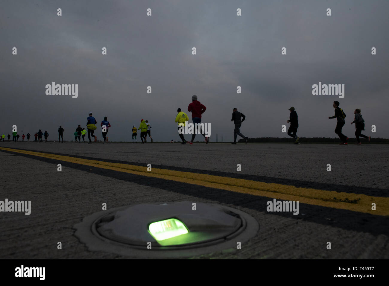 Berlin, Germany. 13th Apr, 2019. Participants in the "Airport Night Run ...