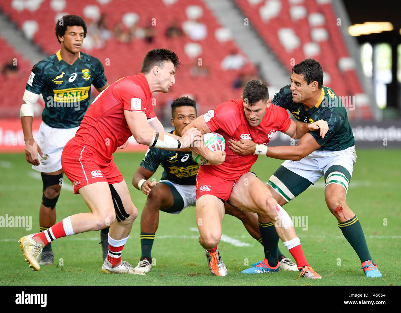Singapore, Singapore. 13th Apr, 2019. South Africa's Chris Dry tackles ...