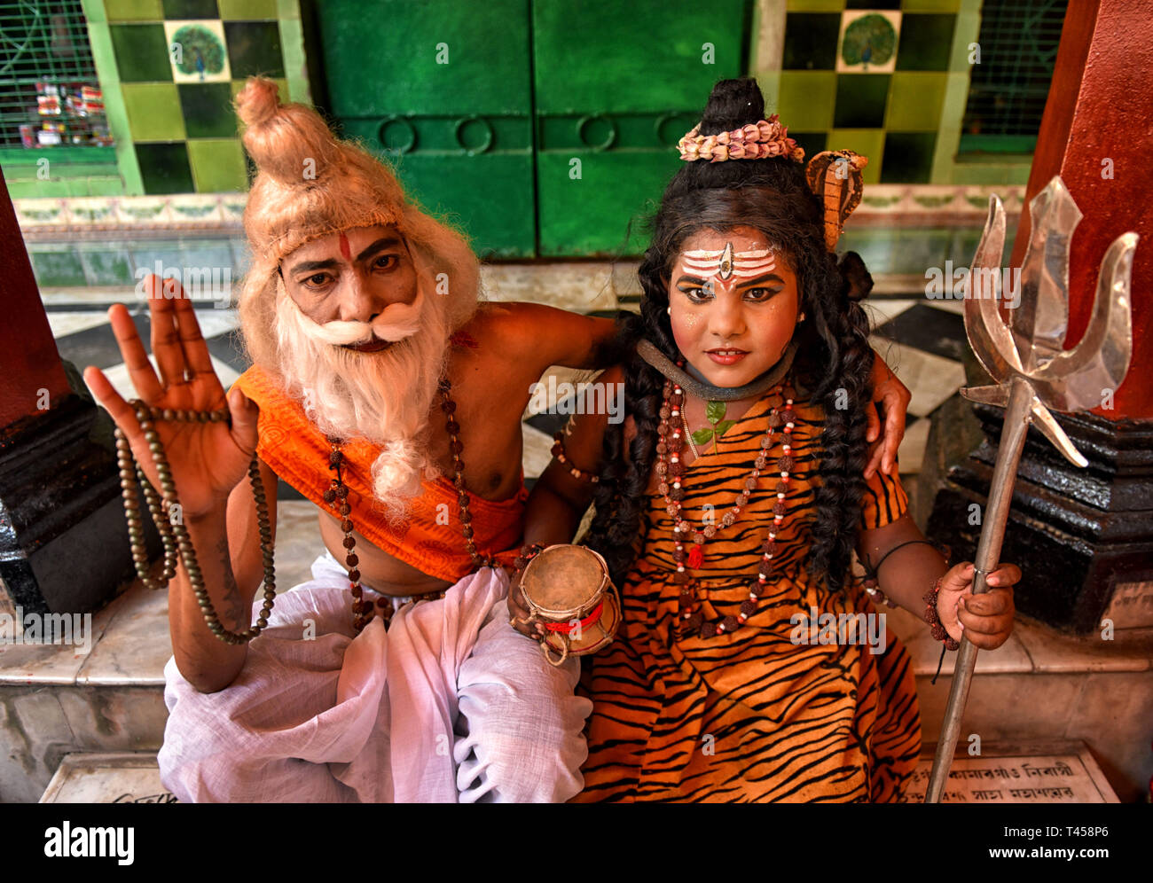 A kid seen dressed up as a Hindu Godess during the festival. Gajan ...