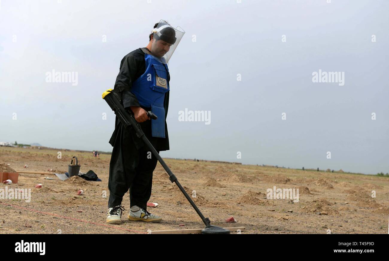 Kandahar, Afghanistan. 13th Apr, 2019. An Afghan de-miner searches for ...