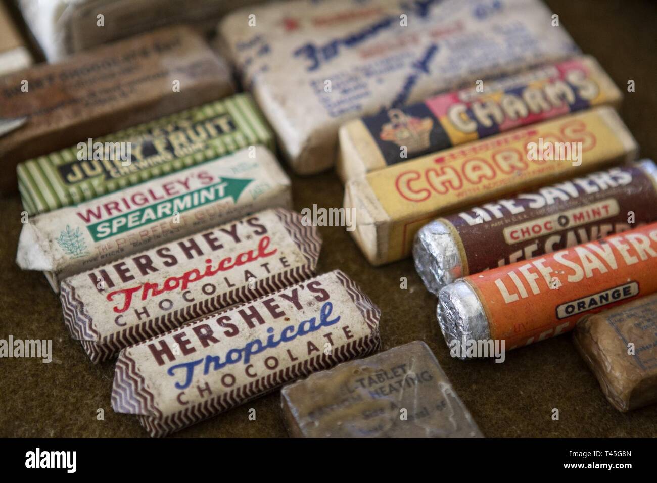World War II-era food rations are displayed by soldiers from the ...