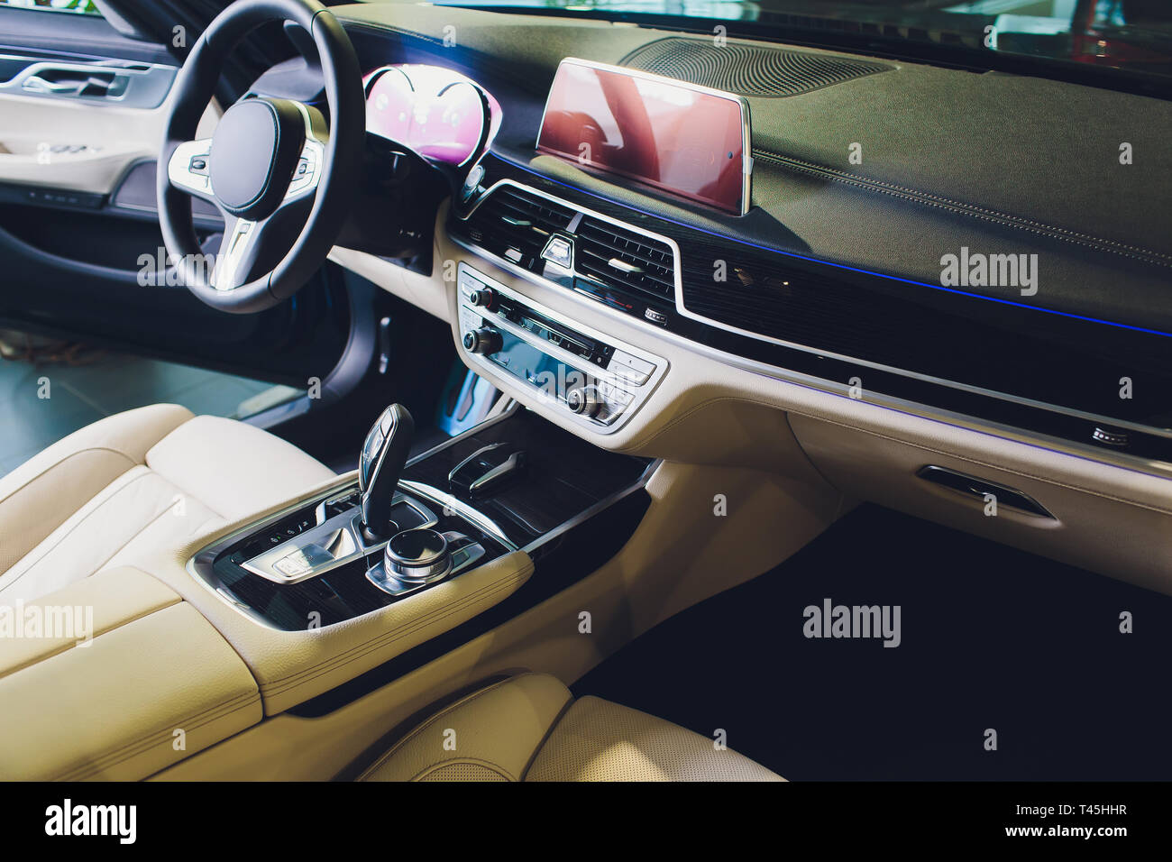 Car luxury inside. Interior of prestige modern car. Front seats with ...