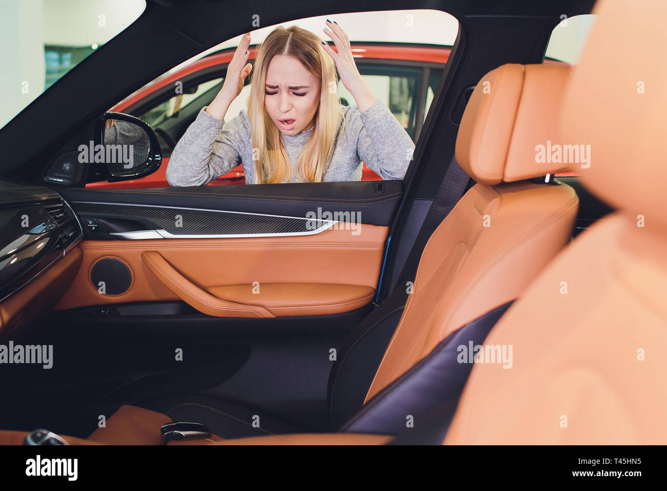 Woman forgot her key inside of her car Stock Photo - Alamy