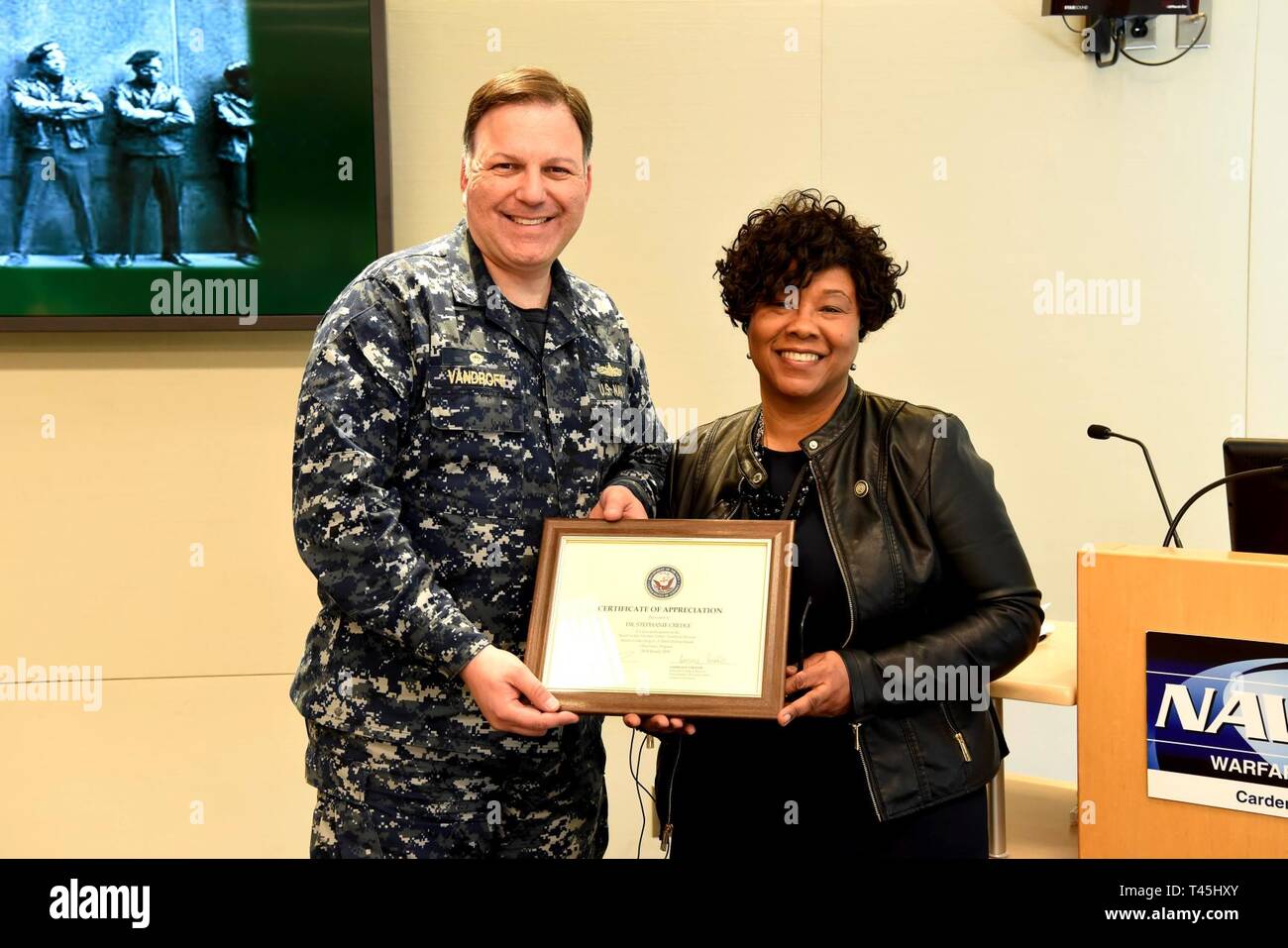 Naval Surface Warfare Center, Carderock Division Commanding Officer Capt. Mark Vandroff presents ...