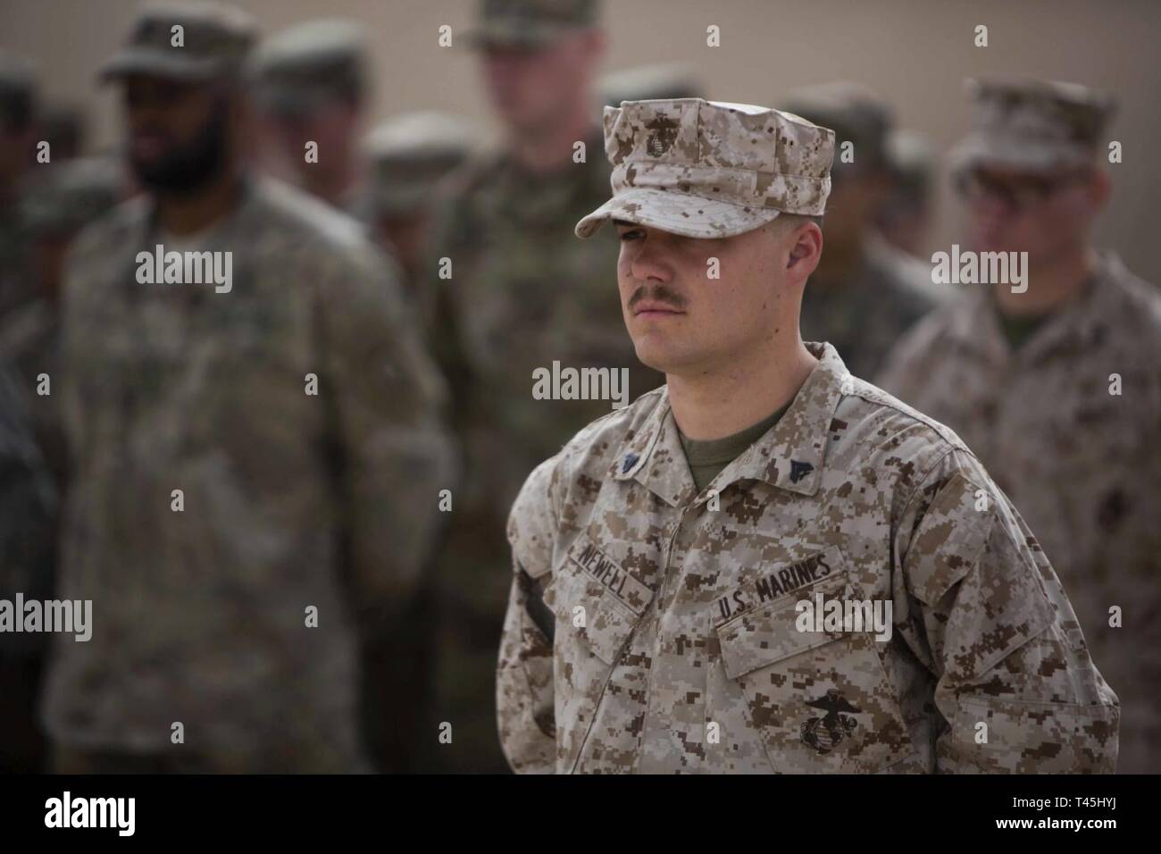 U.S. Marine Corps Cpl. Logan Newell holds the formation of Marines ...