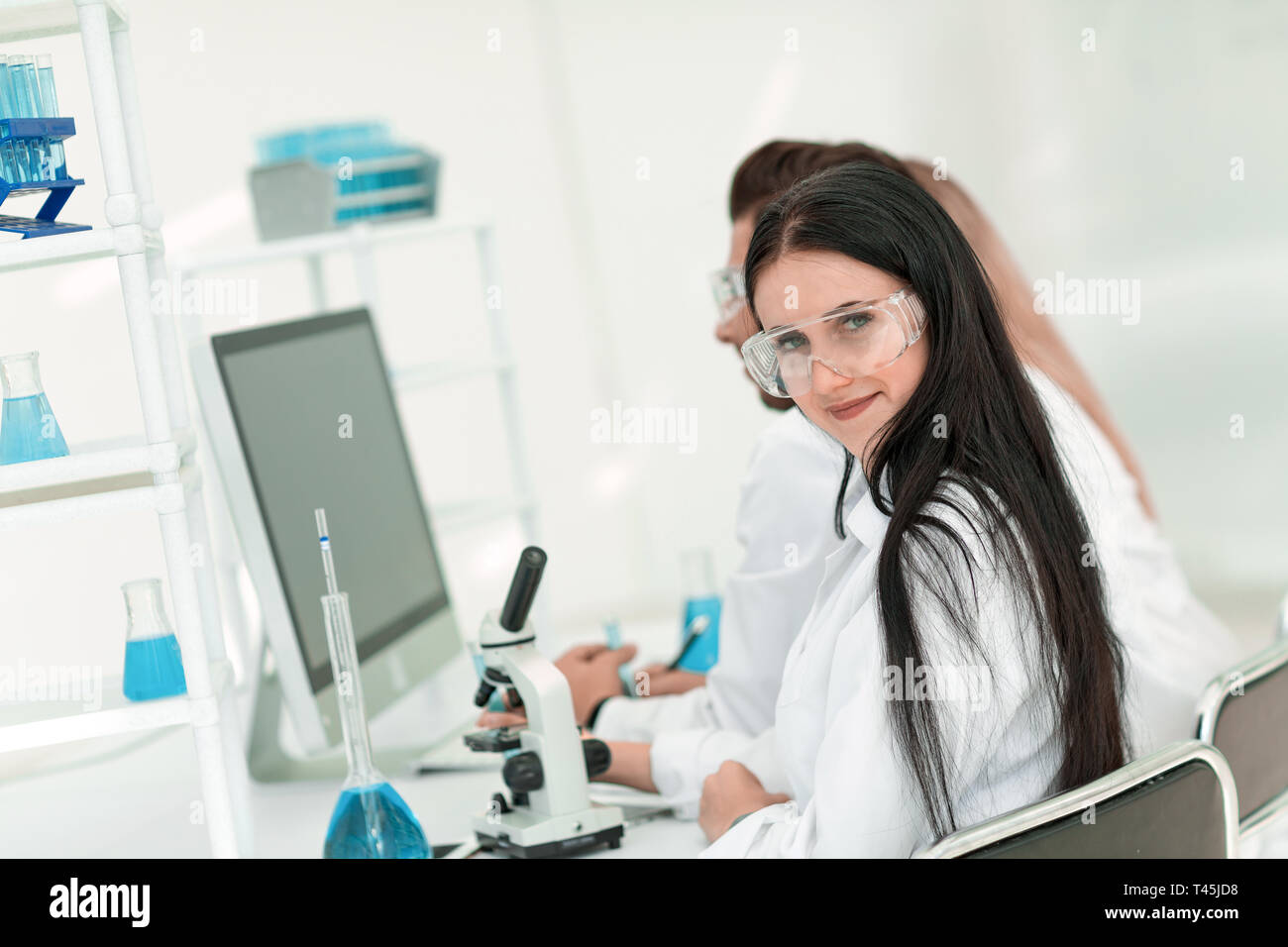 Side view sitting scientist hi-res stock photography and images - Alamy