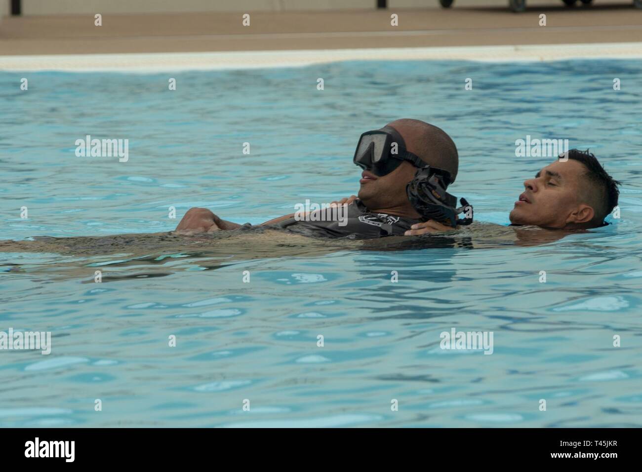 U.S. Navy Petty Officer 2nd Class Mauricio Varonmoncayo executes ...