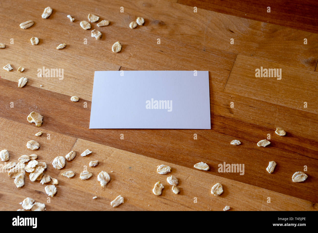 business card mockup templates on a table with sprinkled oatmeal Stock ...